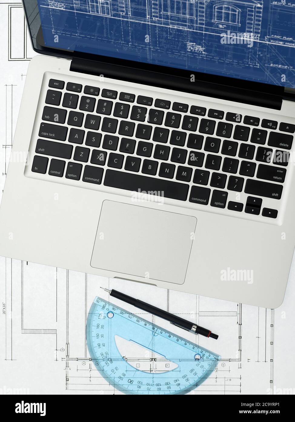 Blueprints, ruler, pen and laptop Stock Photo - Alamy
