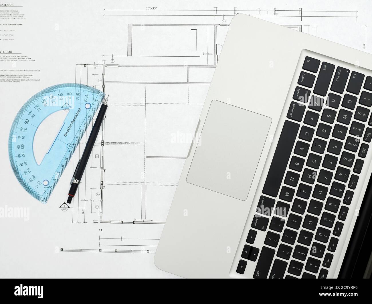 Blueprints and laptop view from above Stock Photo - Alamy