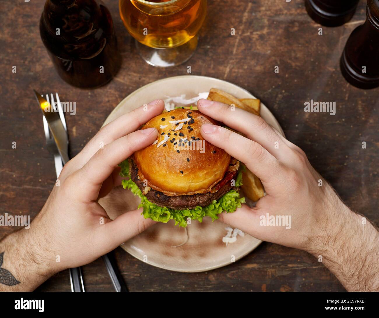 Man eating a burger Stock Photo - Alamy