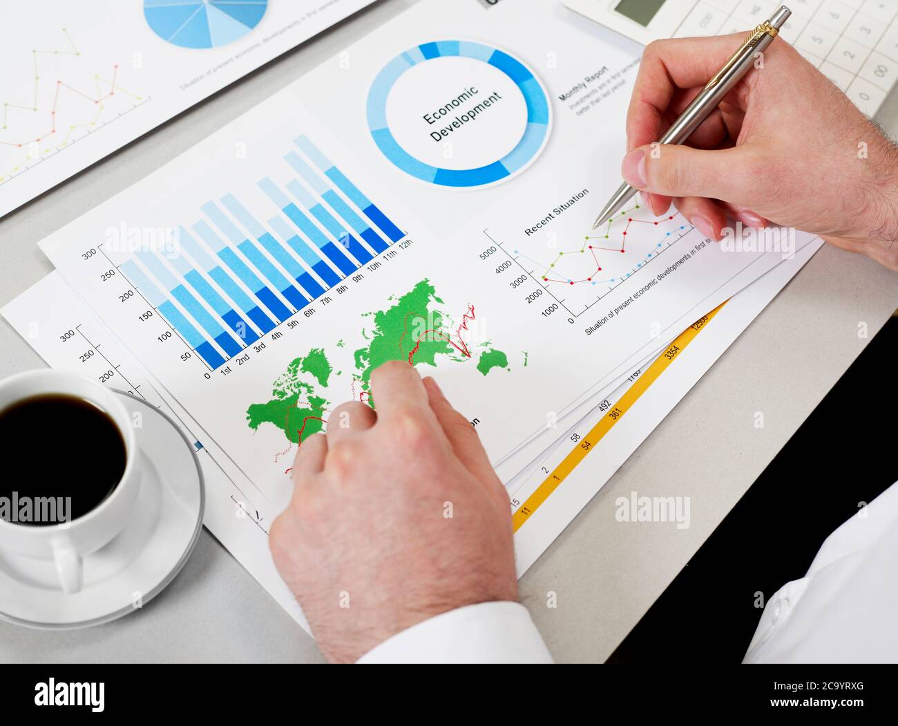 Man showing graph and charts Stock Photo - Alamy