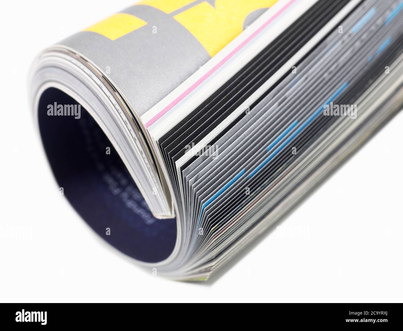 Rolled up magazine newspaper hi-res stock photography and images - Alamy