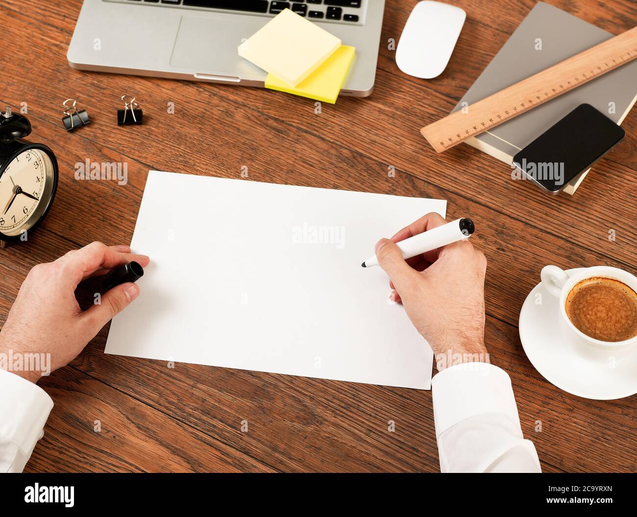 Man writing on paper Stock Photo - Alamy