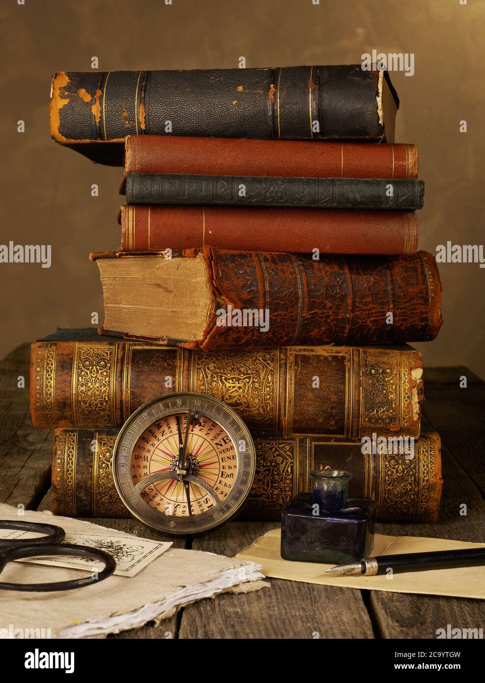 Antique books and writing instruments Stock Photo - Alamy