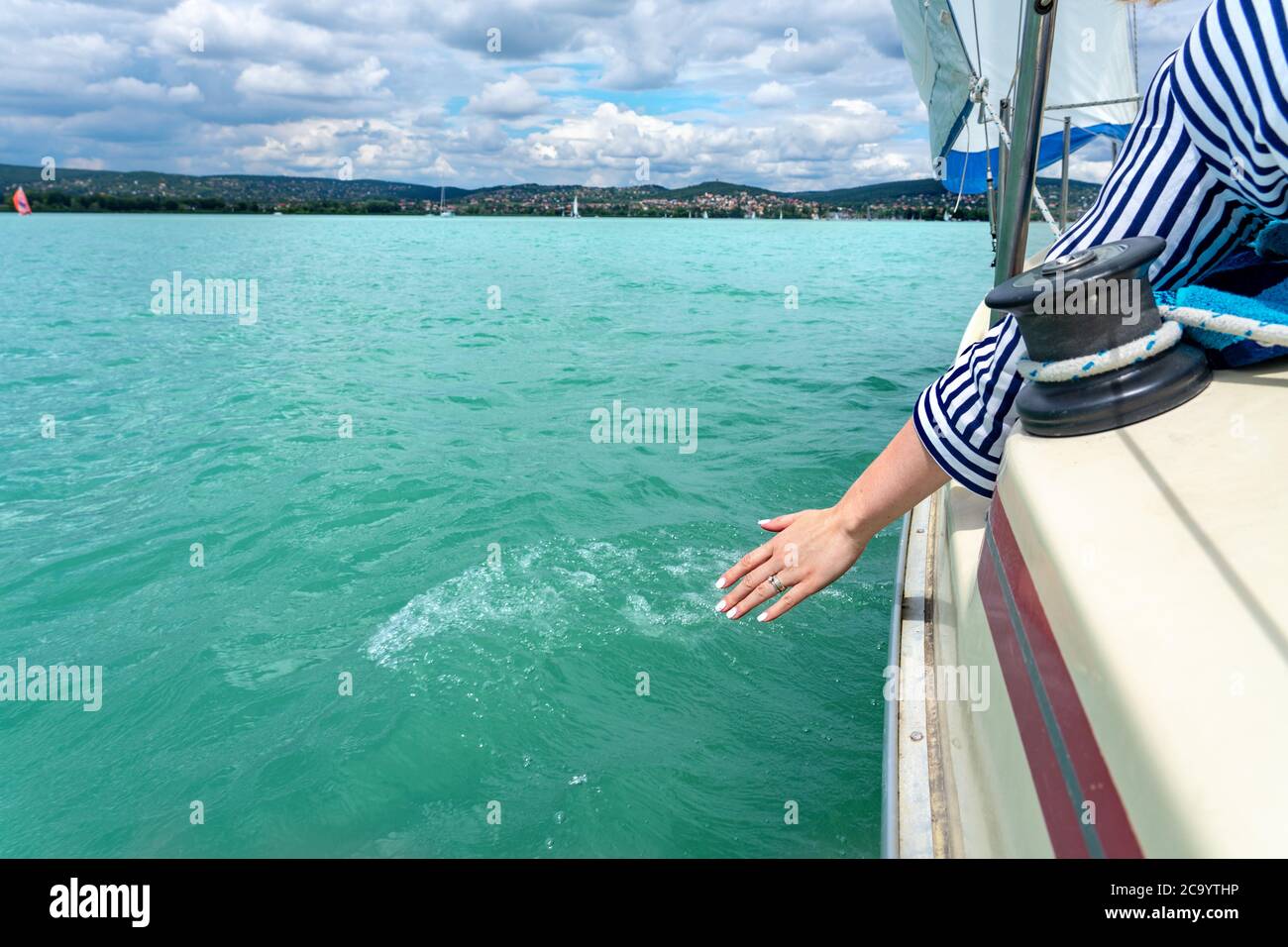 Woman reaching water sailing hi-res stock photography and images - Alamy