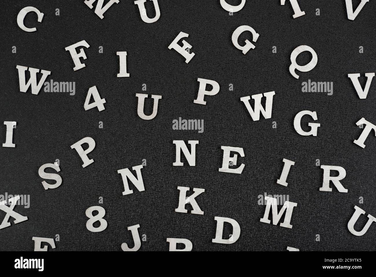 letters of English alphabet on black background. Seamless black and ...