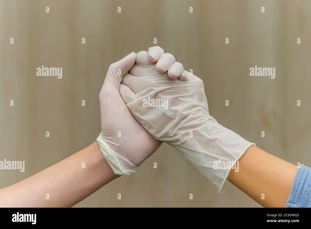 Surgical gloves handshake hi-res stock photography and images - Alamy