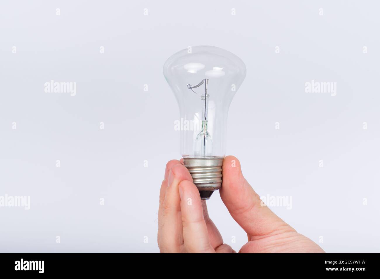 Incandescent bulb in hand hi-res stock photography and images - Alamy