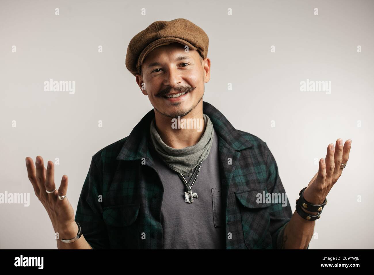 Caucasian repair man with whiskers with pleased smiling expression says ...