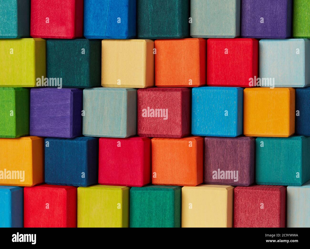 Multi-colored wooden toy blocks background Stock Photo - Alamy