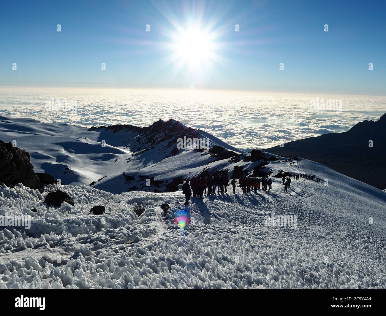 hikers on the ridge ascend mount kilimanjaro the tallest peak in africa ...