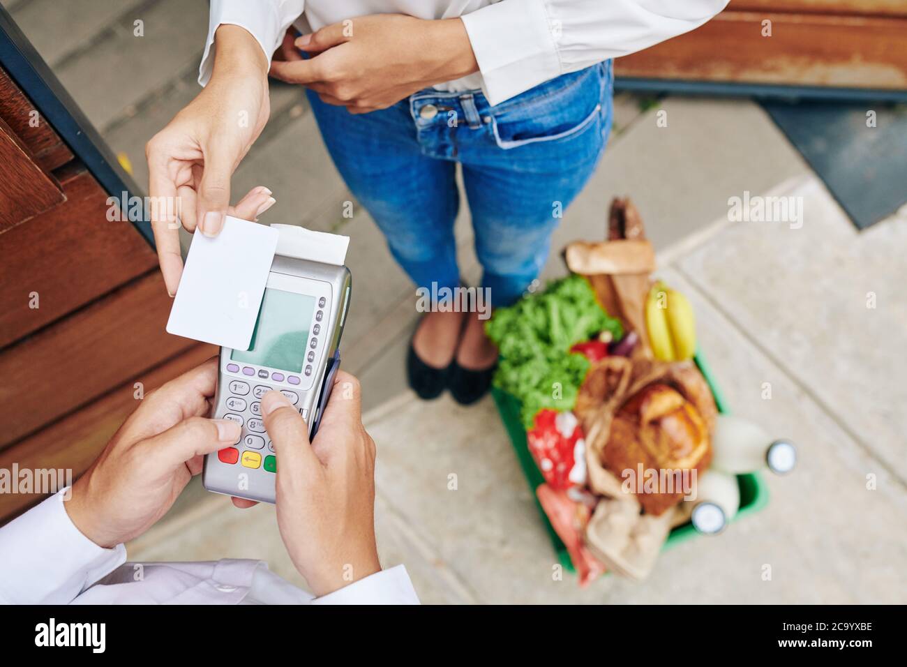 Female customer paying credit hi-res stock photography and images - Alamy