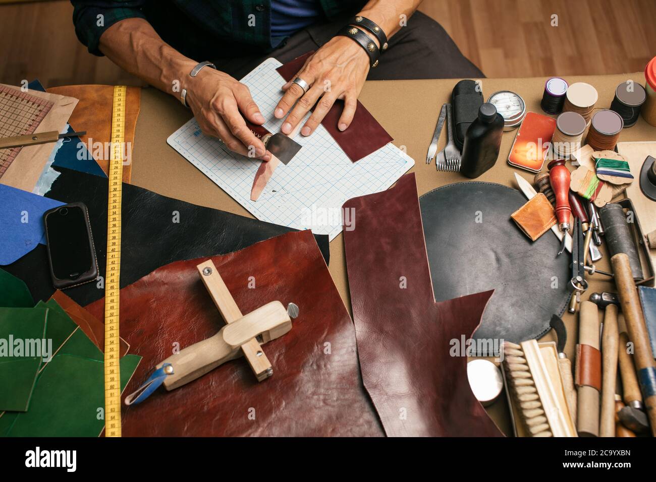 Top view of male shoemaker hands holding cobbler tools for making new ...