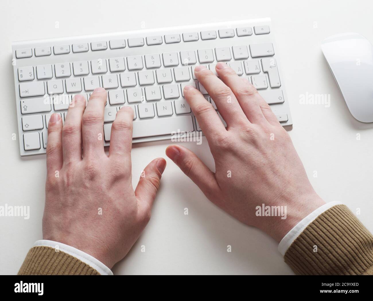 Typing on keyboard Stock Photo - Alamy