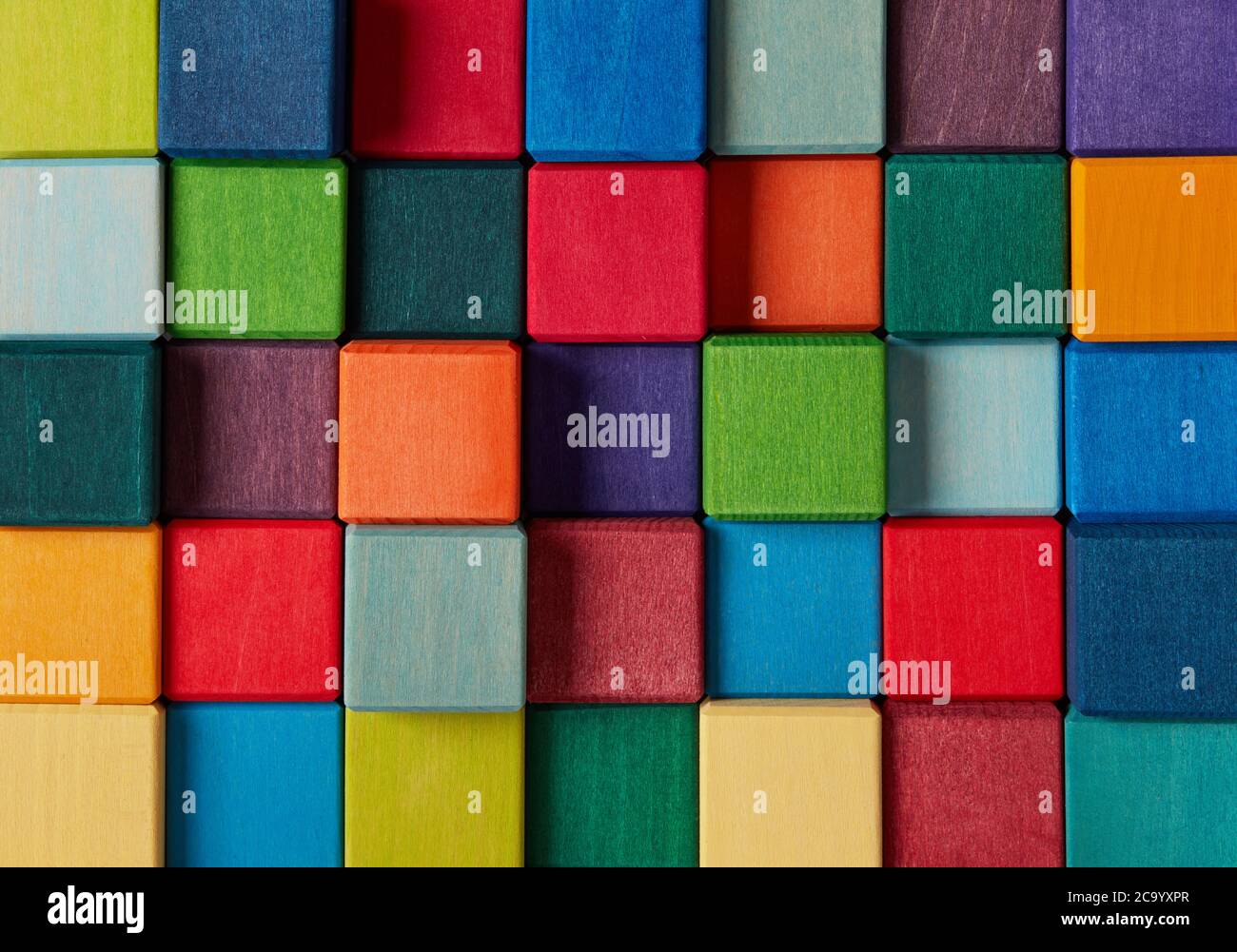 Multi-colored wooden toy blocks background Stock Photo - Alamy