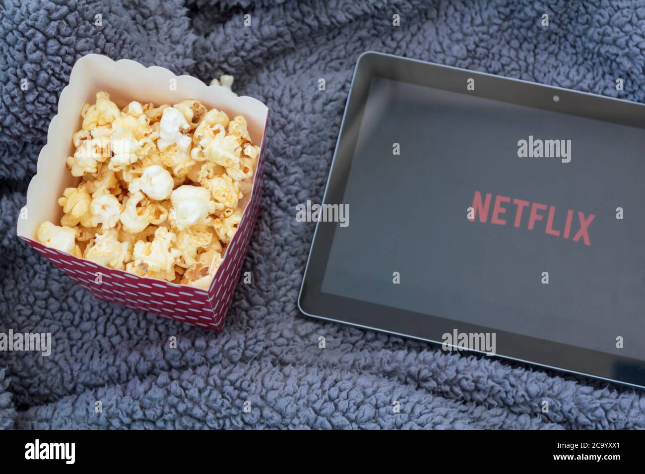 Box of popcorns, netflix and warm soft blanket Stock Photo - Alamy