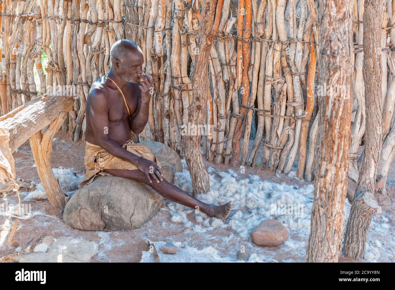 DAMARALAND, NAMIBIA - MAY 30, 2011: A Damara man inside a workshop at ...
