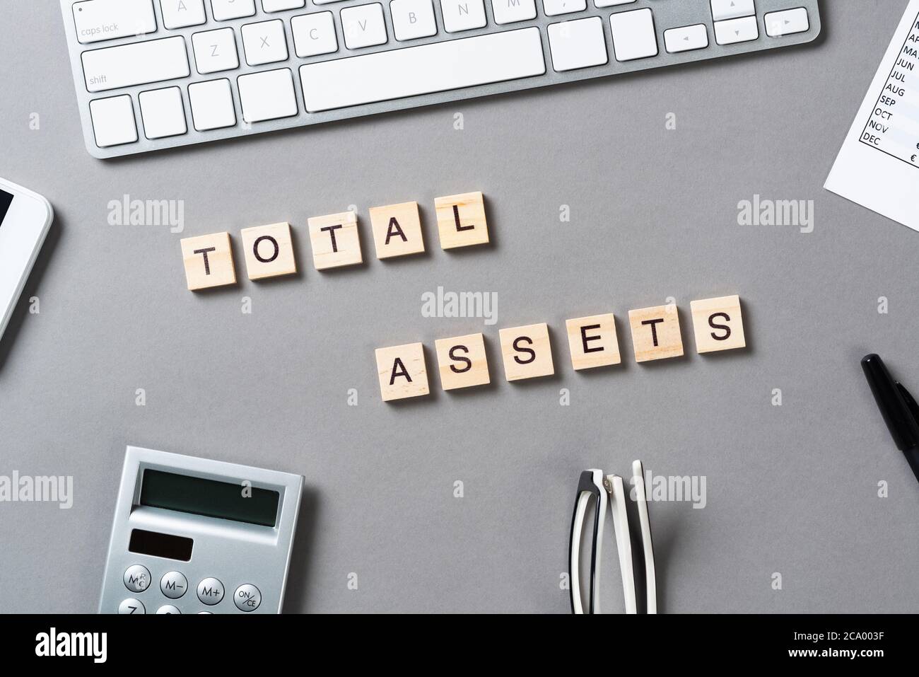 Total assets concept with letters on cubes Stock Photo - Alamy