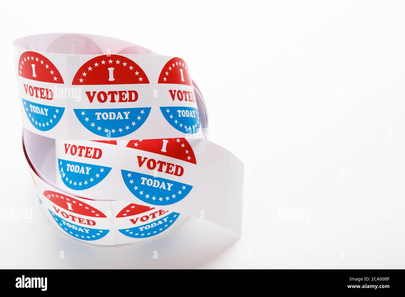 Roll of red white and blue I voted stickers with American flag Stock ...