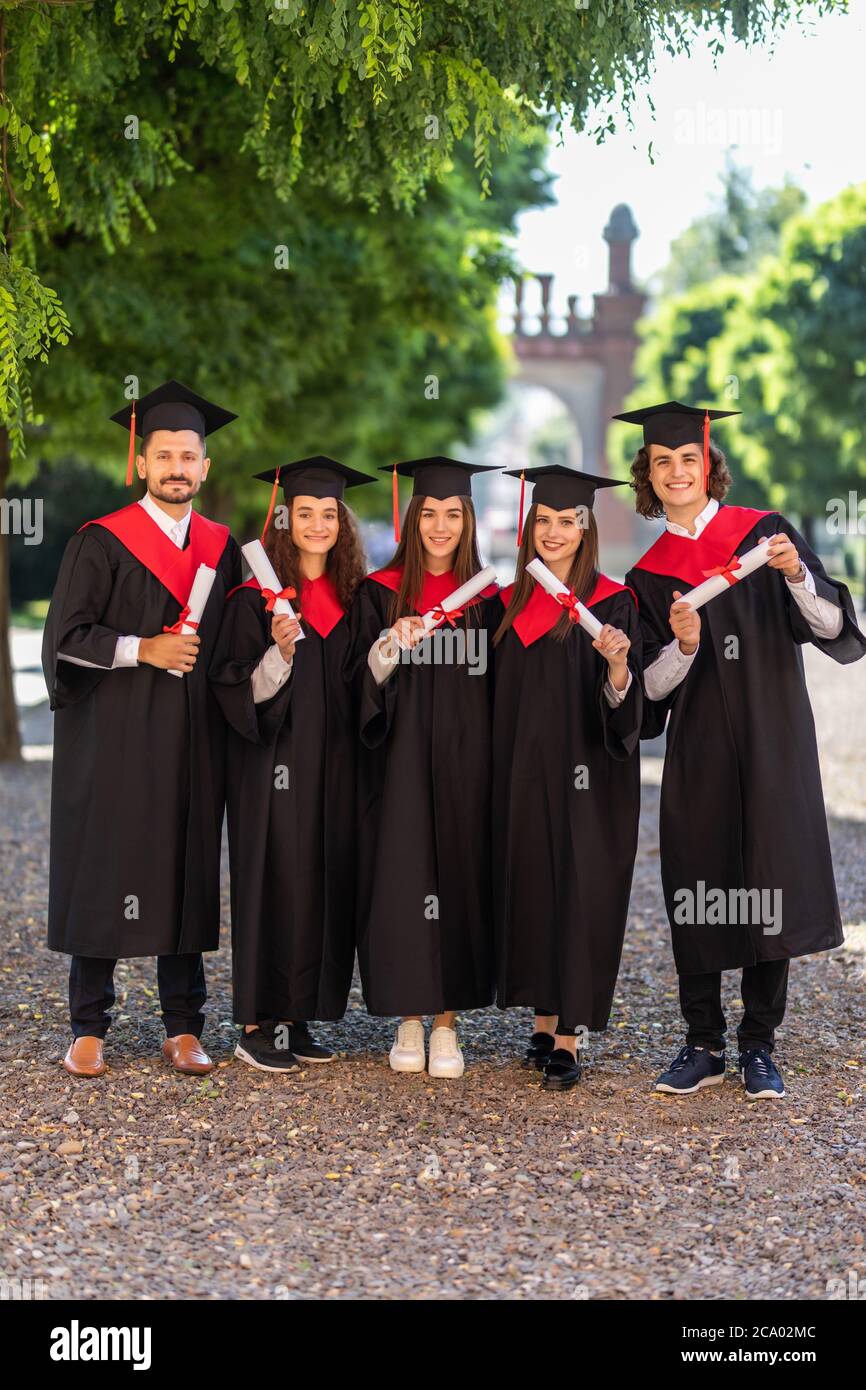 Happy Group Of University Graduates At Graduation Ceremony Stock Photo happy-group-of-university-graduates-at-graduation-ceremony-stock-photo