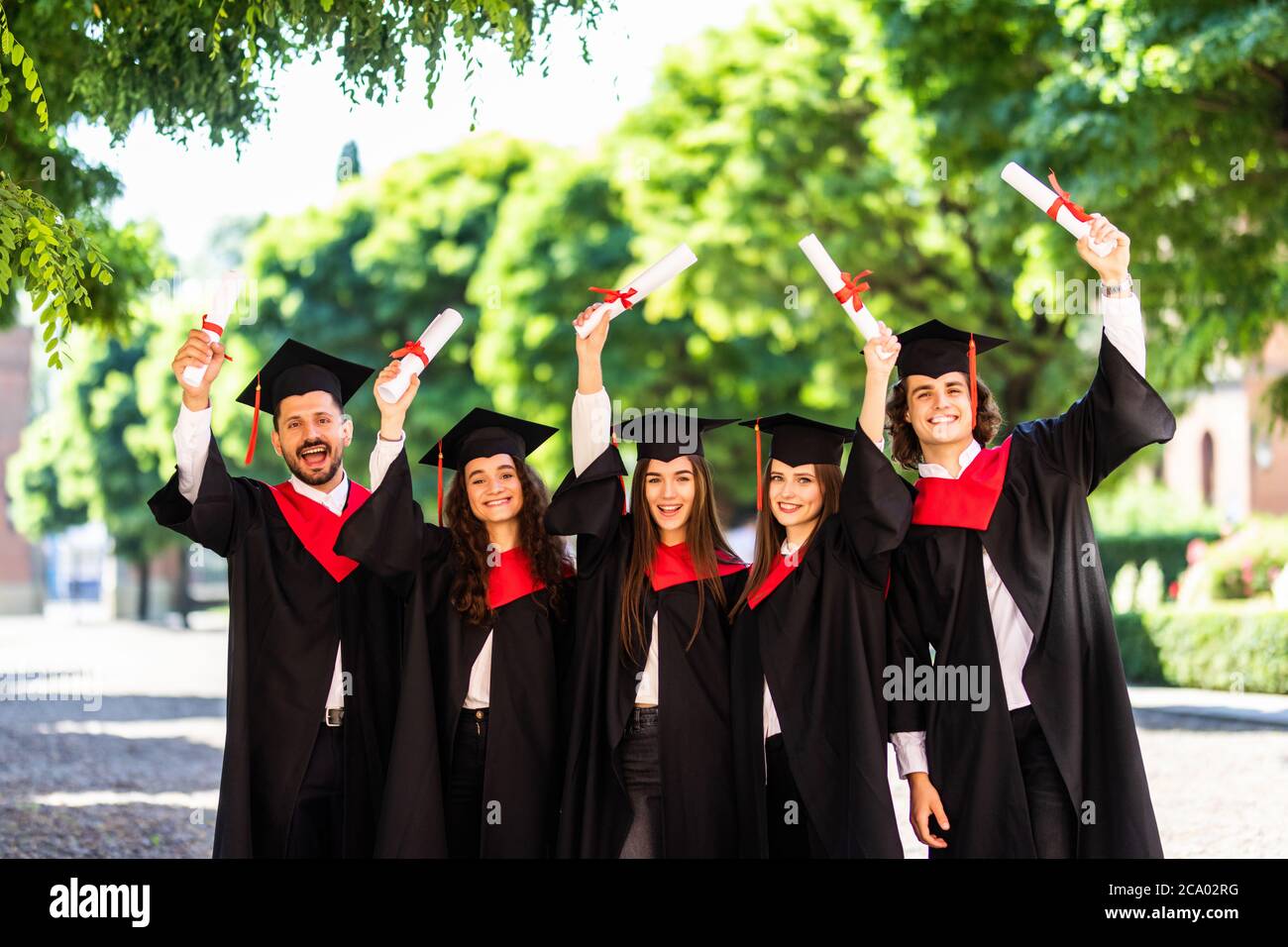 education, graduation and people concept - group of happy international ...