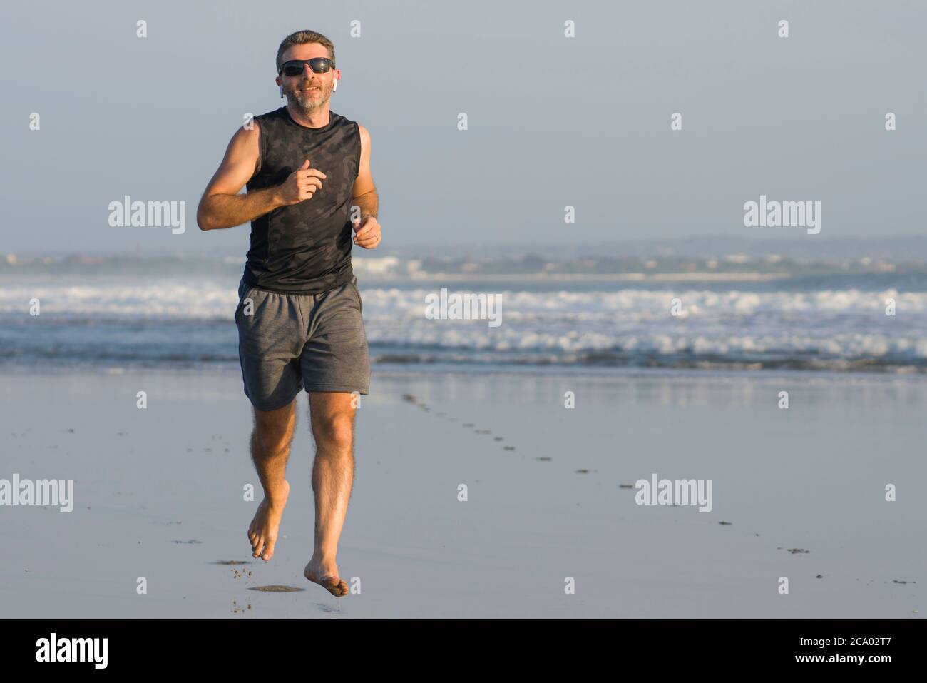 Fit attractive body in 40s exercising hi-res stock photography and ...