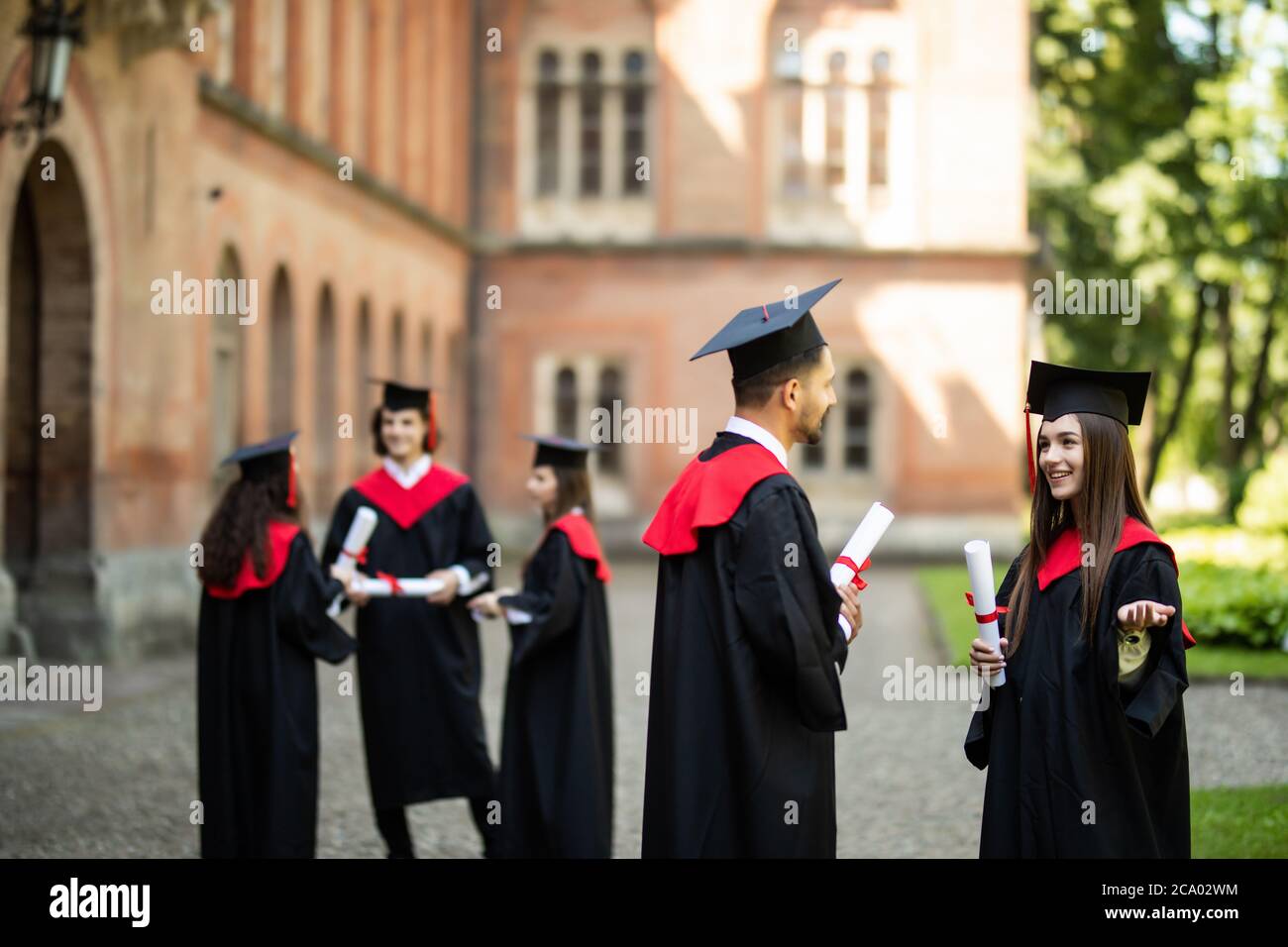 A female graduate who holds a university diploma holds a diploma ...