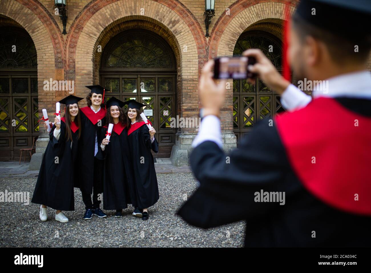 Group of students taking a picture in their graduation Stock Photo - Alamy