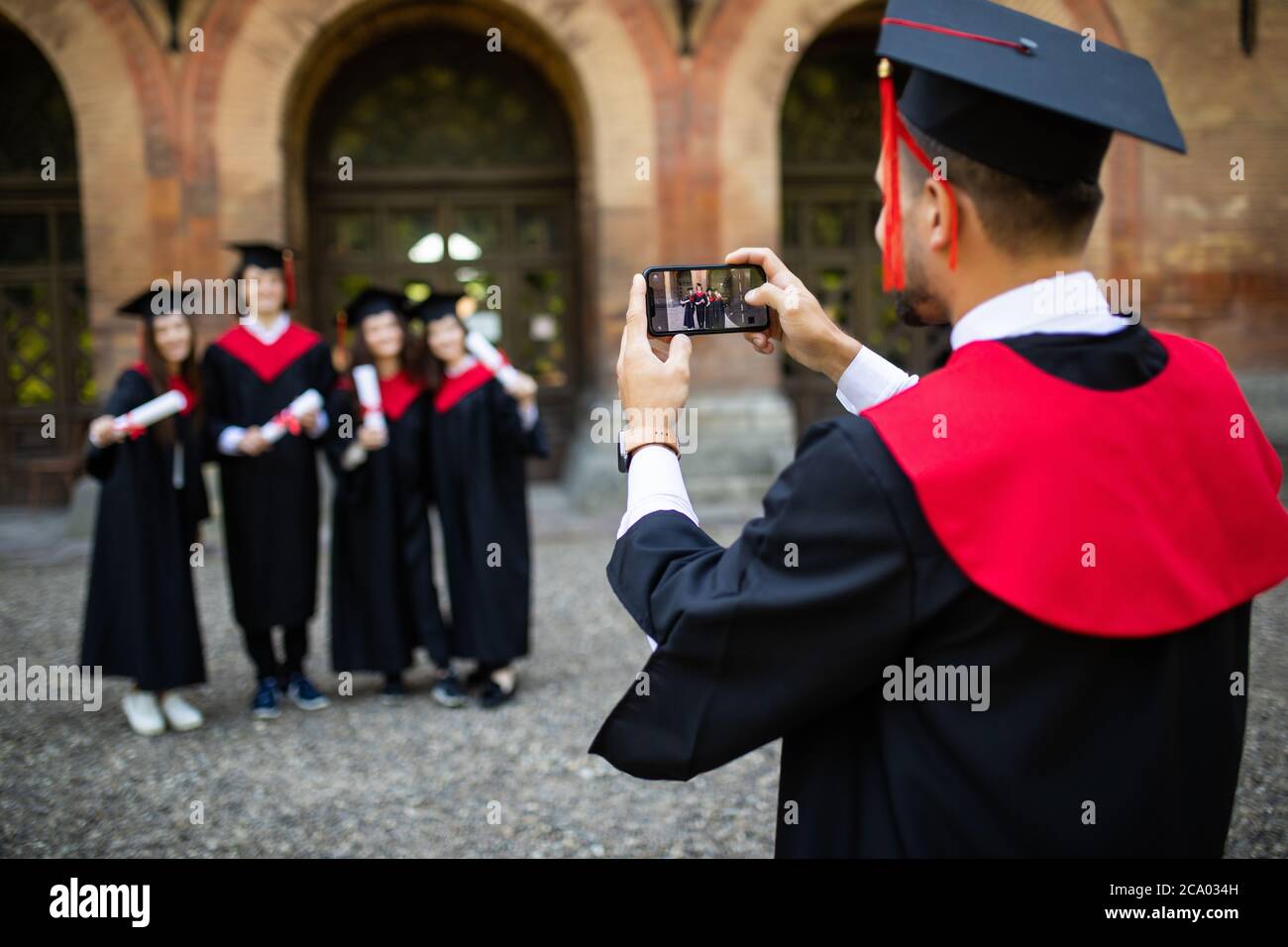 Group of students taking a picture in their graduation Stock Photo - Alamy