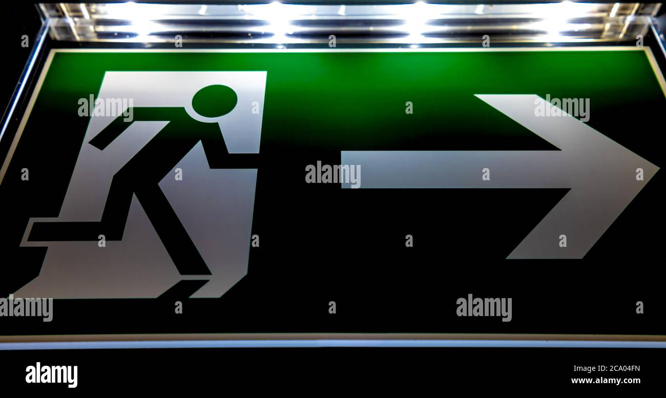 Illuminated Exit Sign Board Stock Photo - Alamy