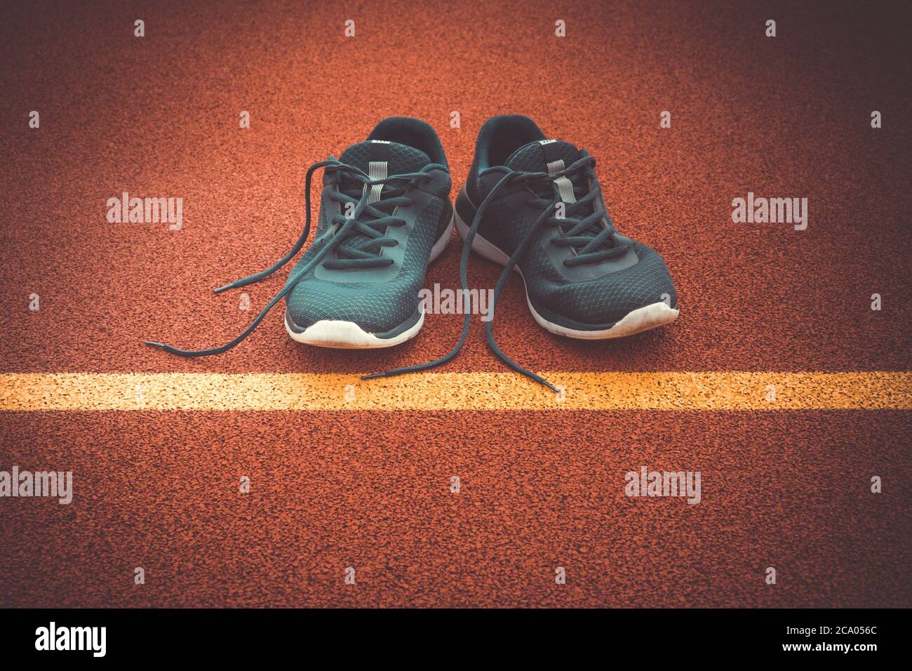 Running shoes on the start line on running track in the stadium Stock ...