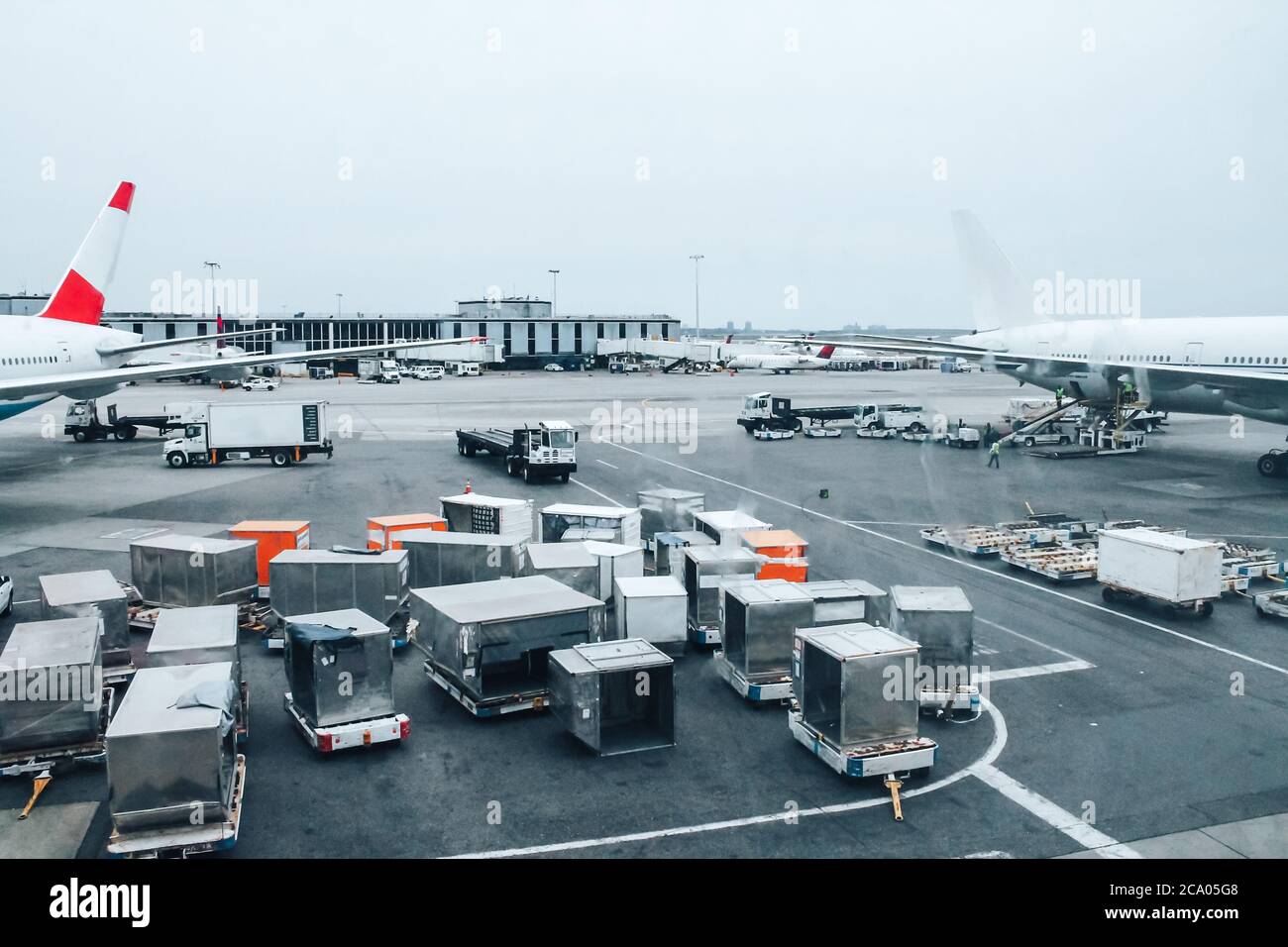 Large airport with cars, containers and planes Stock Photo - Alamy