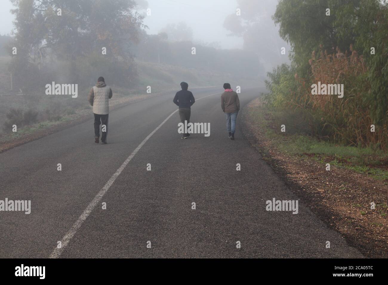 walking strangers through road Stock Photo - Alamy