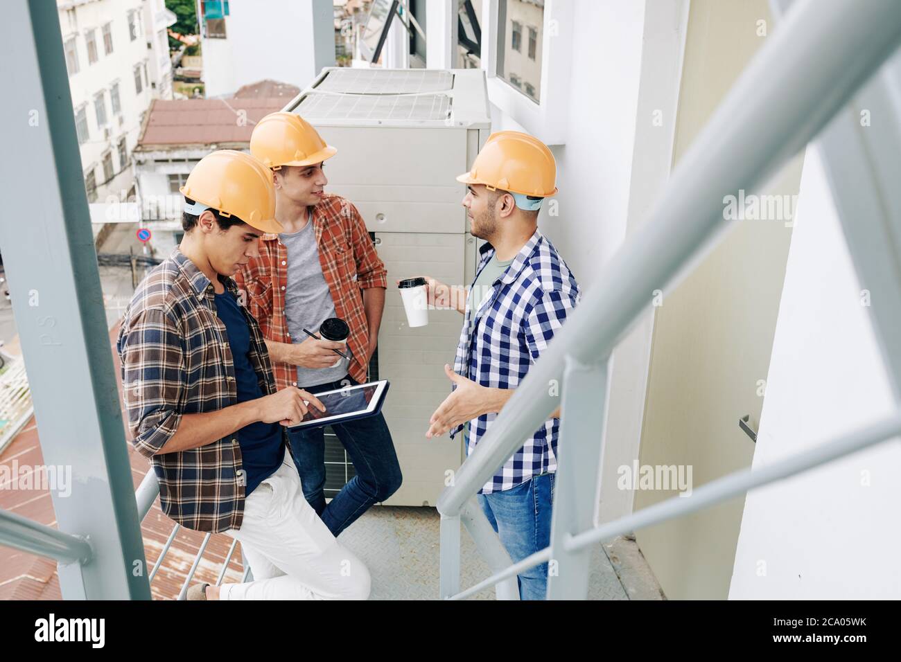 Construction drinking coffee construction site hi-res stock photography ...