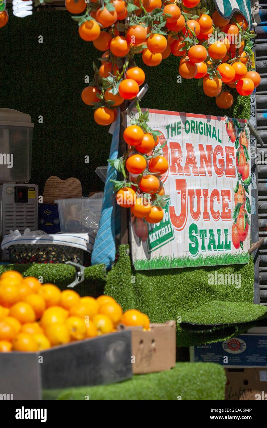 Orange juice stall selling freshly made OJ. Camden London Stock Photo ...