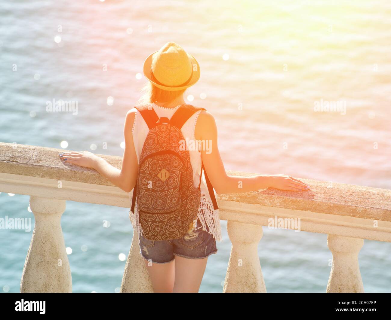 Girl looking out from balcony hi-res stock photography and images - Alamy