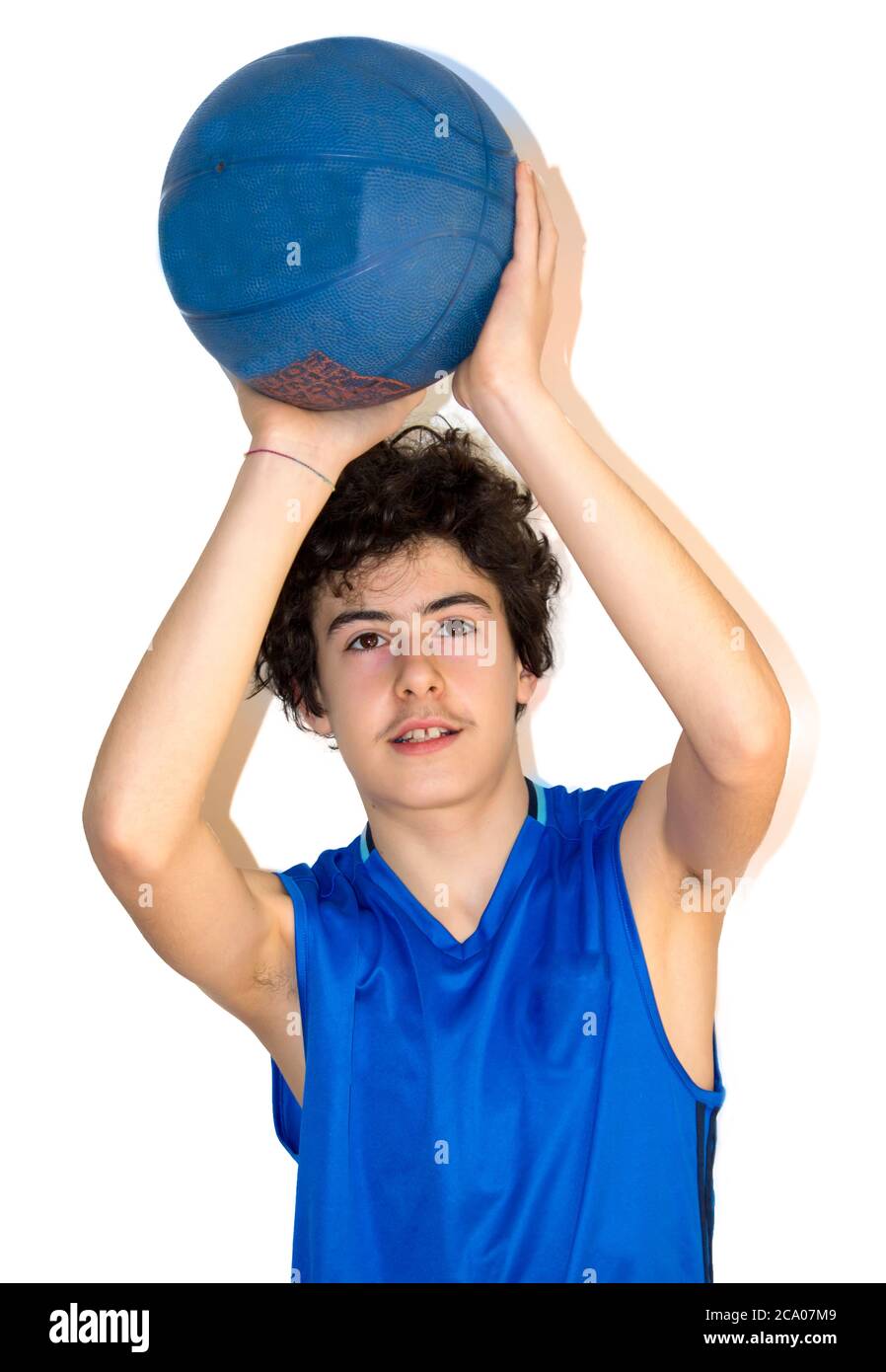 Young boy playing basketball in a isolated background Stock Photo - Alamy