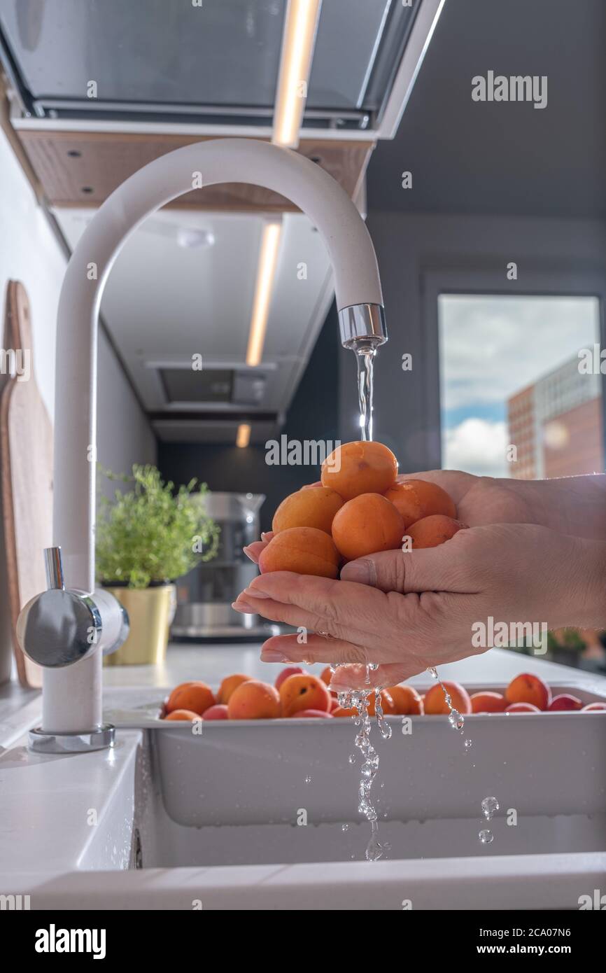 Hand washing fruit hi-res stock photography and images - Alamy