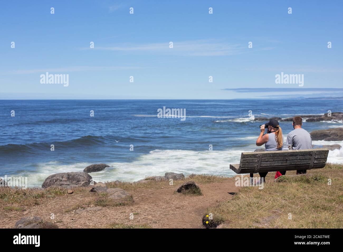 Man and woman on bench whale watching hi-res stock photography and ...