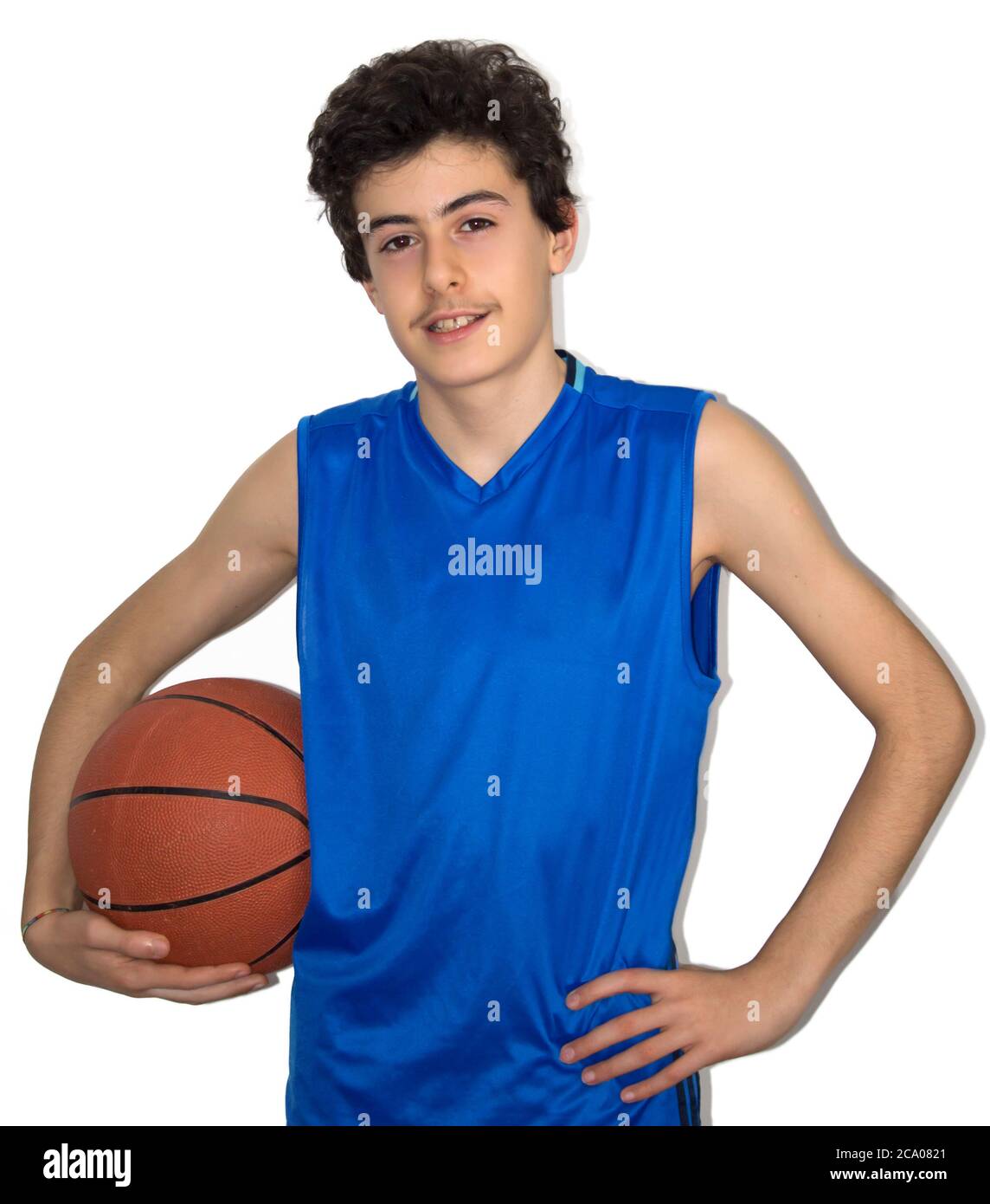 Young boy playing basketball in a isolated background Stock Photo - Alamy
