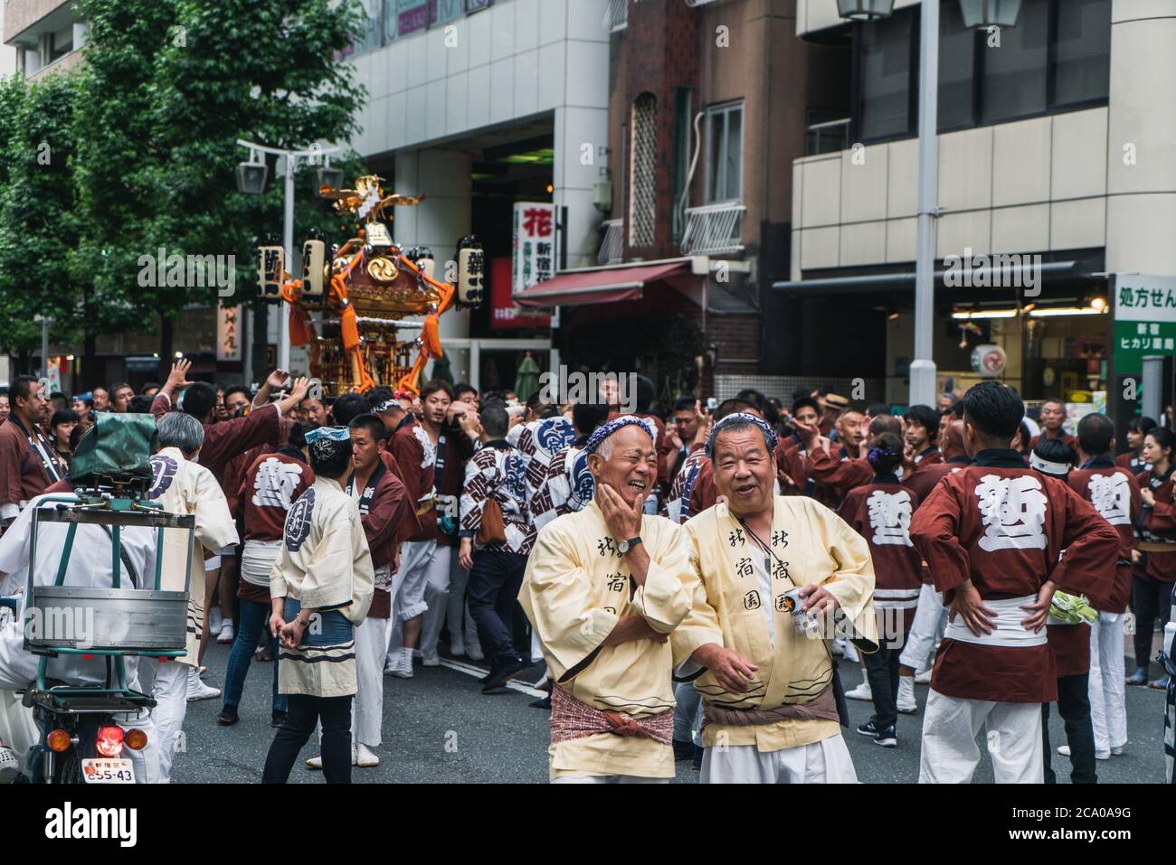 Crowds of japanese people carrying Shinto Shrine Mikoshi around the ...