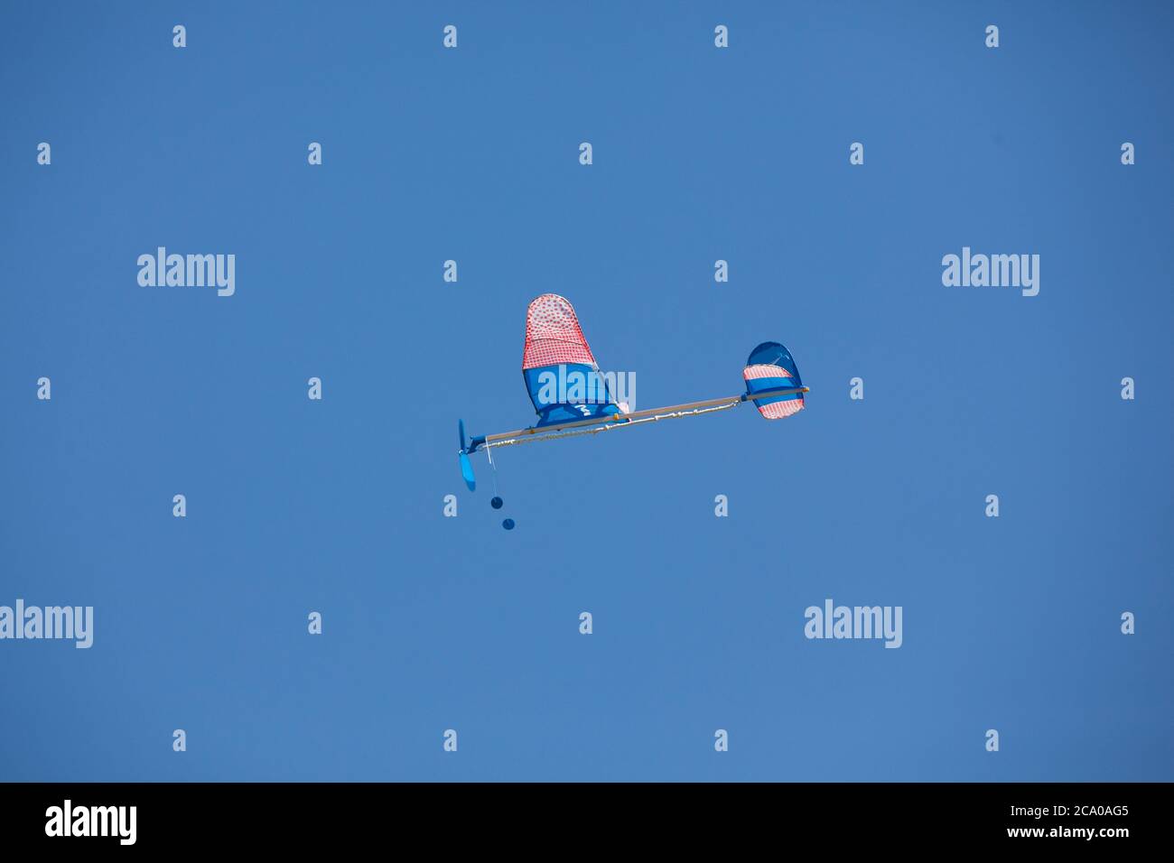 Rubber powered glider flying in the sky. model airplane Stock Photo - Alamy