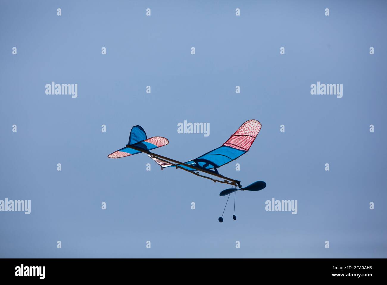 Rubber powered glider flying in the sky. model airplane Stock Photo - Alamy