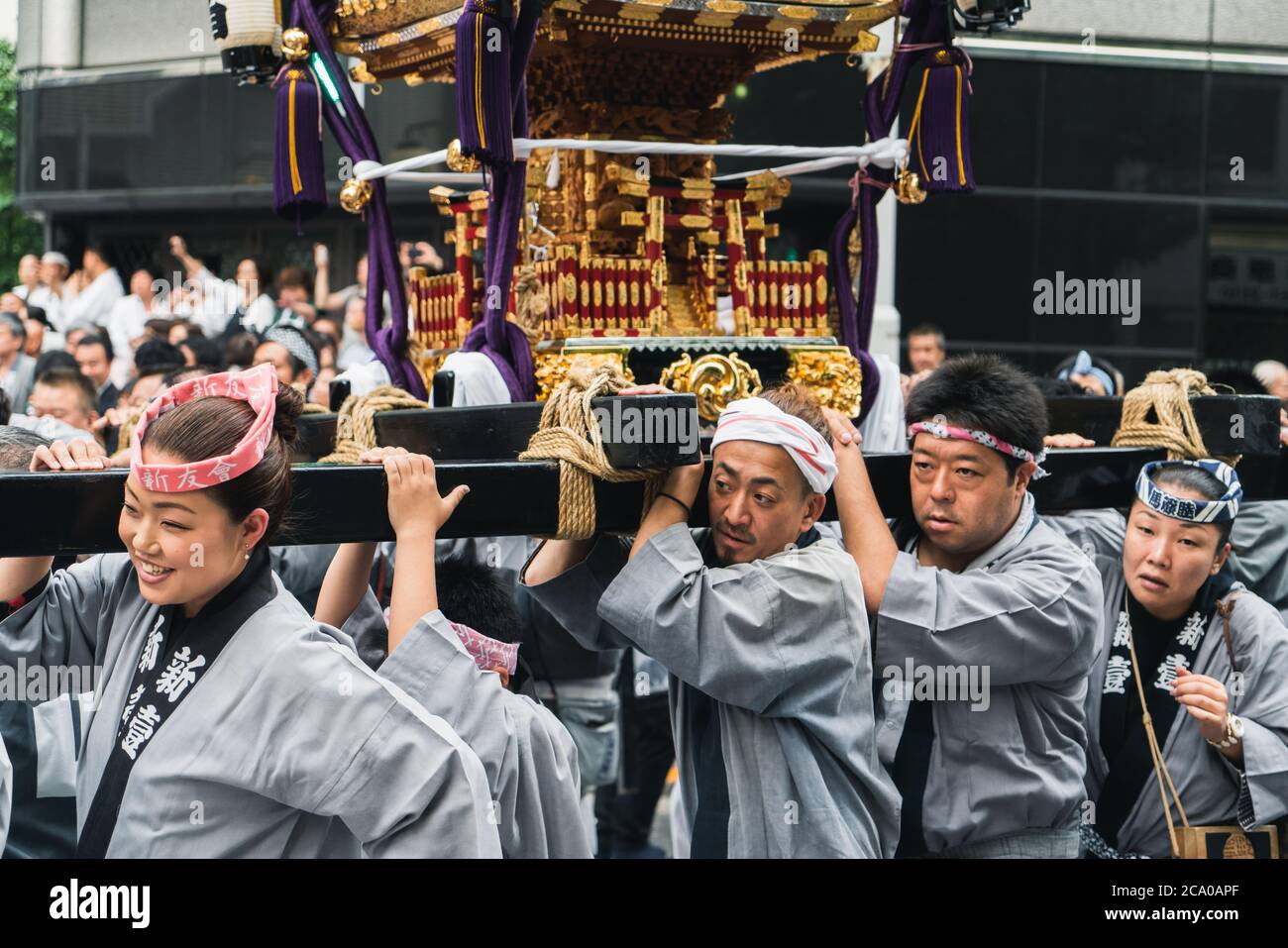 Crowds of japanese people carrying Shinto Shrine Mikoshi around the ...
