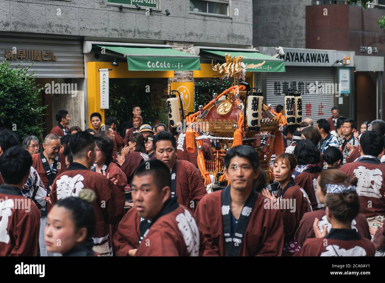 Crowds of japanese people carrying Shinto Shrine Mikoshi around the ...