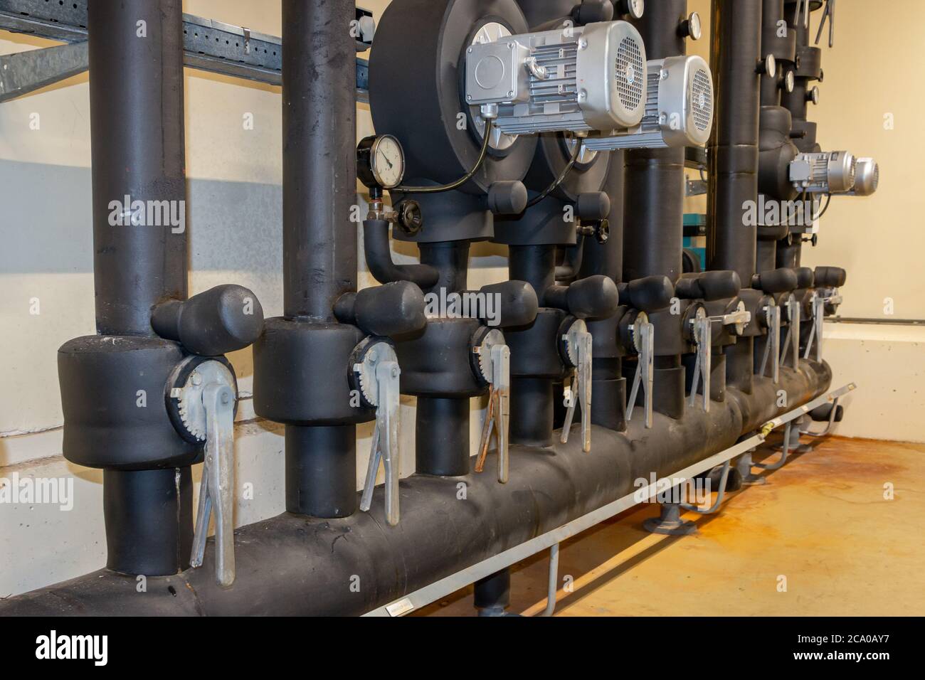 Central heating system in an industrial building, with insulated pipes ...