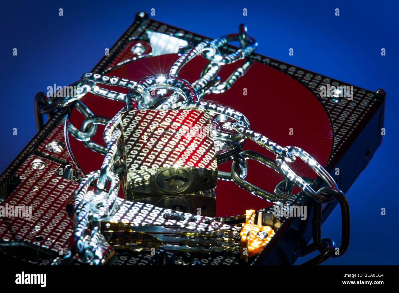 A hard disk drive (HDD) in padlocked chains with data projected on it ...