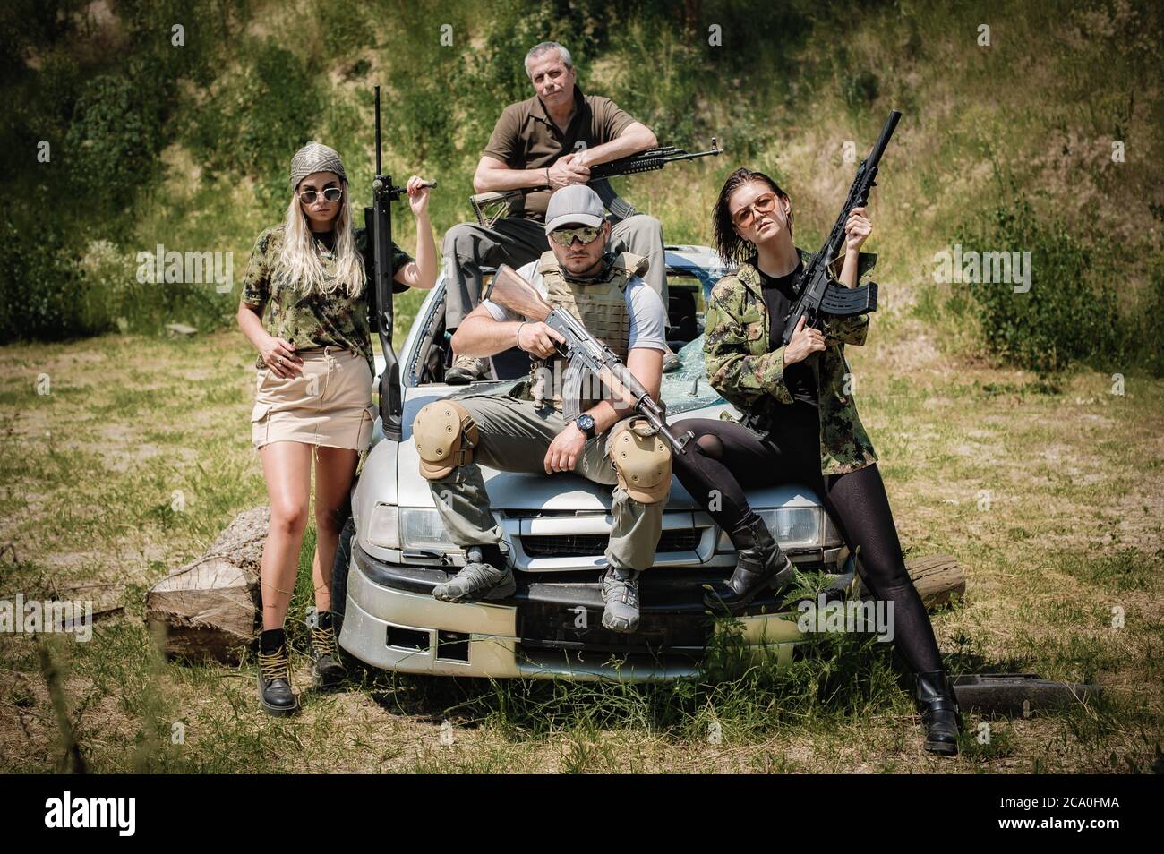 Mixed female and male combat team squad with weapons. Gun, rifle and ...