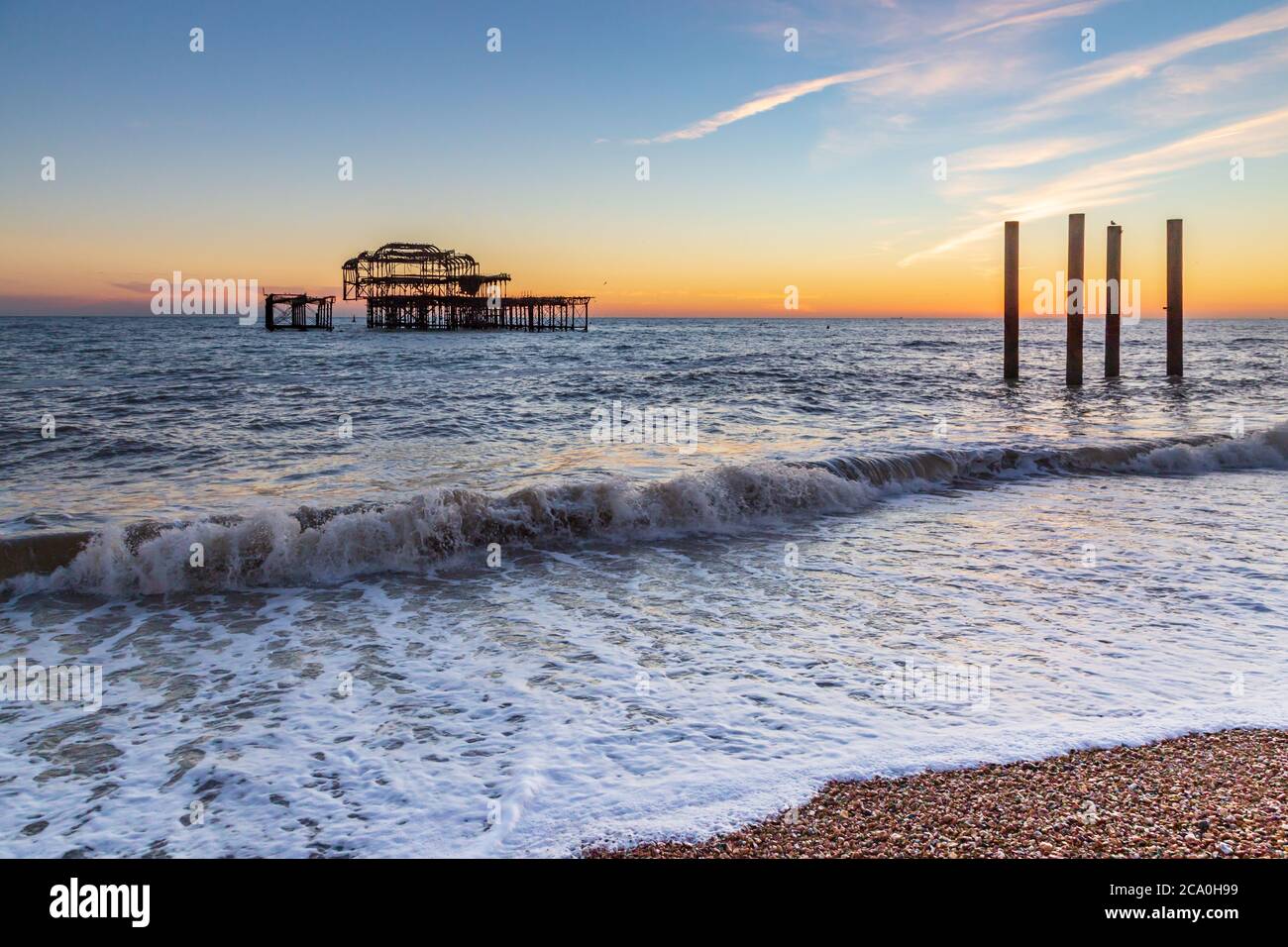 Brighton's Old West Pier at Sunset Stock Photo - Alamy