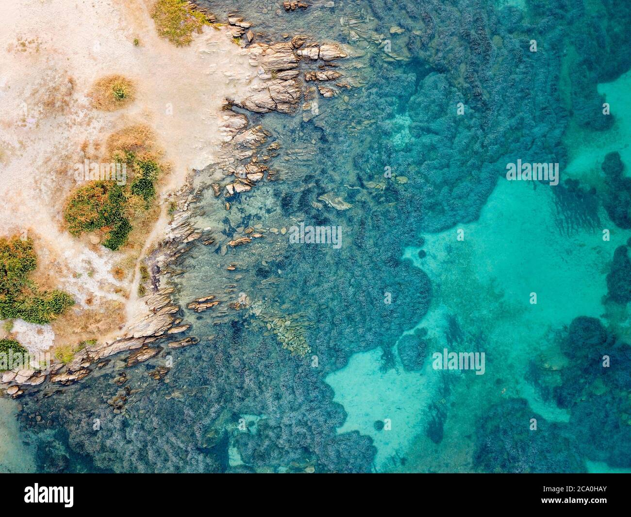 ocean beach from above with blue water of the sea and yellow coast line ...