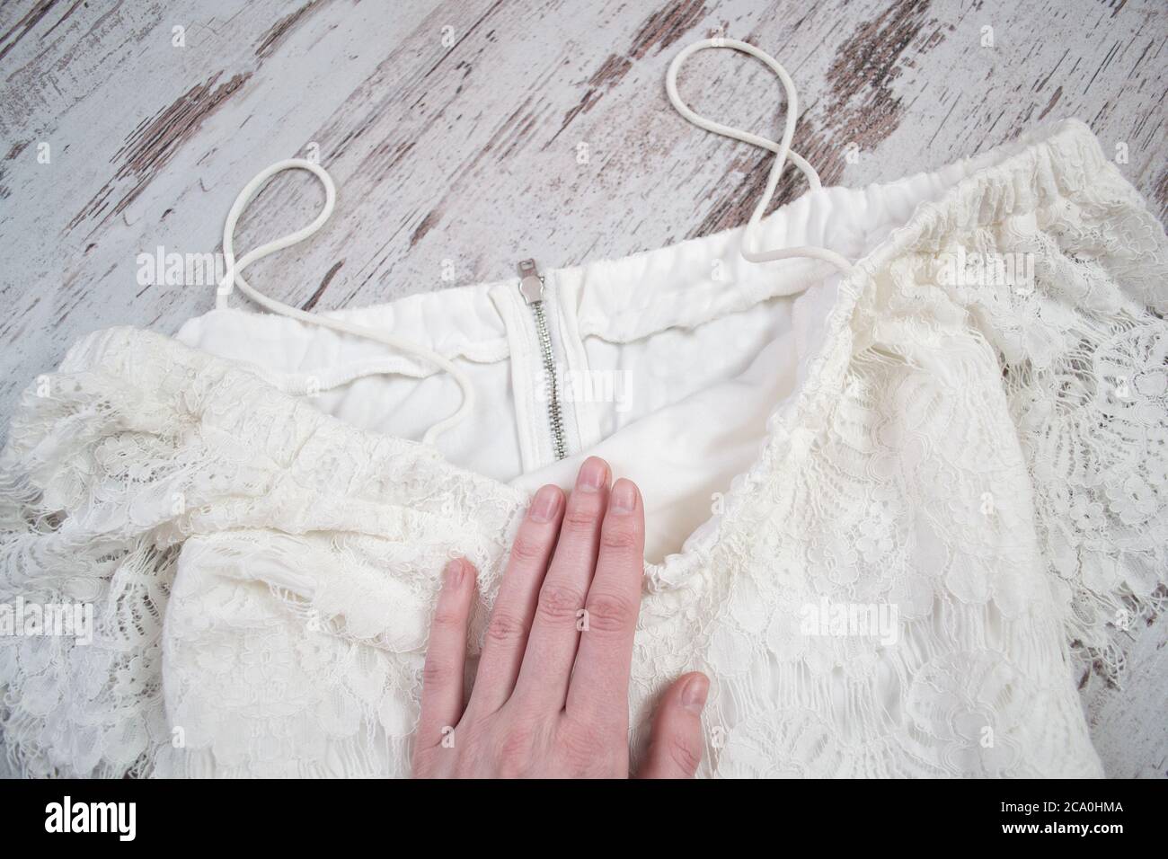 Female hand and white lace blouse. Fashionable concept Stock Photo - Alamy